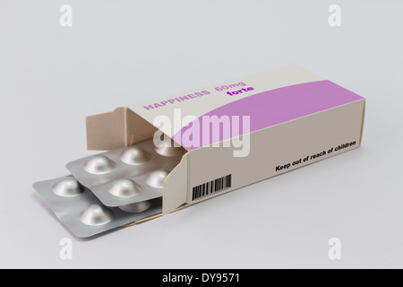 Open medicine packet labelled happiness opened at one end to display a ...