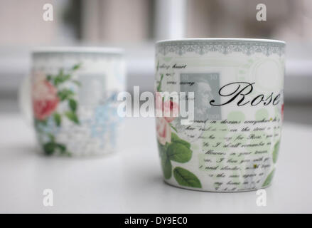 Two mugs with a print of a faded stamp with a portrait of Nazi dictator ...