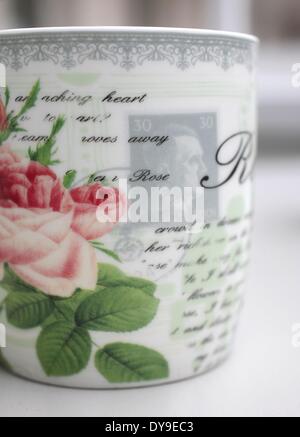 A mug with a print of a faded stamp with a portrait of Nazi dictator ...