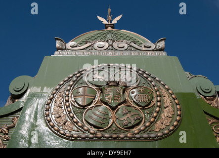 crest on hammersmith bridge, crossing the river thames in west london ...