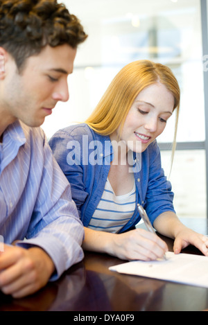 Couple clients signing paper contract with professional broker or ...