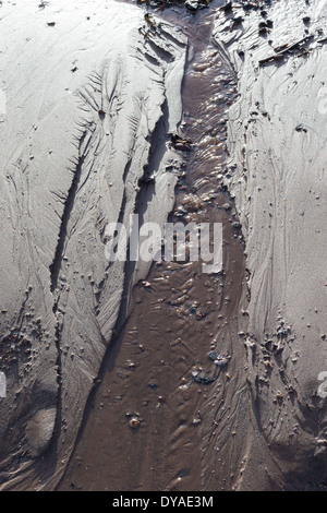 Water Draining from Beach Sand Stock Photo - Alamy