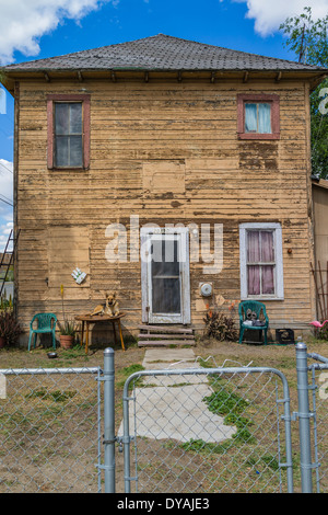 An uncared for two-story wooden house in the Central Valley town of ...