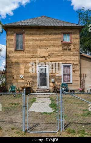 An uncared for two-story wooden house in the Central Valley town of ...