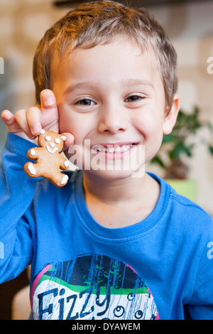 Homemade cute gingerbread Christmas cookie decorated with white icing ...