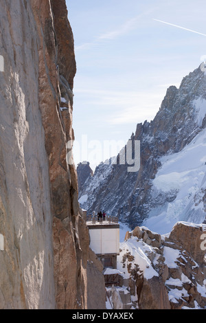 Tourists visit a lookout point at the Aiguille Du Midi (3842m) mountain ...
