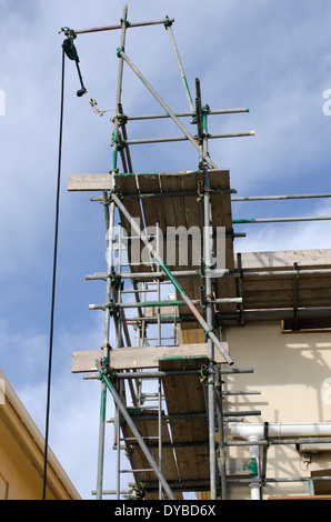 Construction scaffolding on residential building facade during ...
