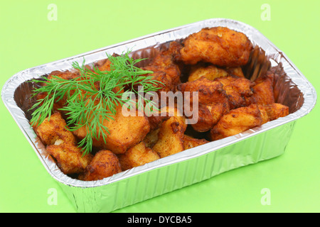 Fried cod pieces in take away tray Stock Photo - Alamy