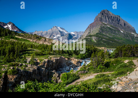 USA MONTANA View of Swift Current Lake and red canoe Glacier National ...