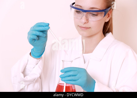 Cute girl student takes test sample, close up Stock Photo - Alamy