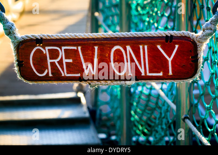 Crew Only sign, wooden badge Stock Photo - Alamy