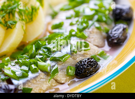 Salted herring with marinated onion and boil potato Stock Photo - Alamy