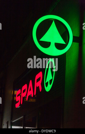 The front view of Spar shop at night Stock Photo - Alamy
