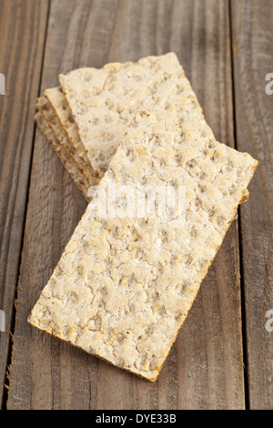 Multiple slices of wheat crispbread on wooden table Stock Photo - Alamy
