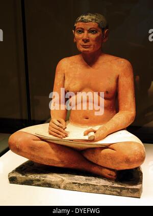 Scribe sitting cross-legged with a papyrus in his lap 2350 B.C. Egypt ...