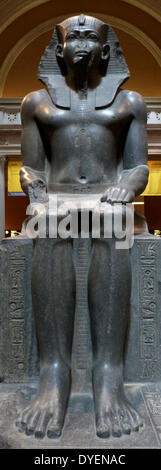 Colossal seated statue of an Egyptian pharaoh. Possible Amenemhat II ...