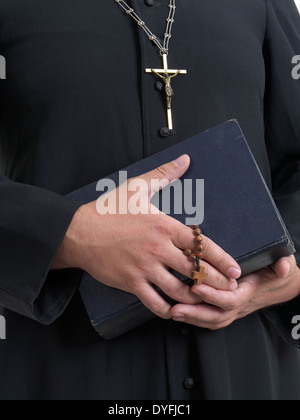 Closeup of catholic priest's hands holding the rosary Stock Photo - Alamy
