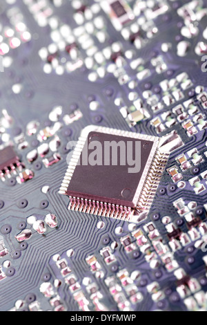 Violet circuit board background of computer motherboard.Computer chip ...