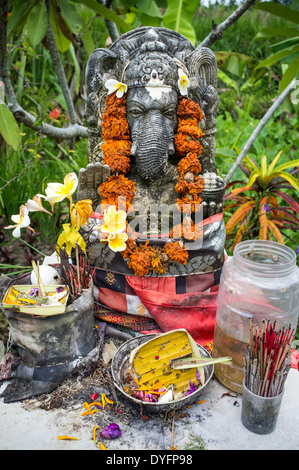 Indonesian statue in a temple with offerings Ubud Ubud Bali Indonesia ...
