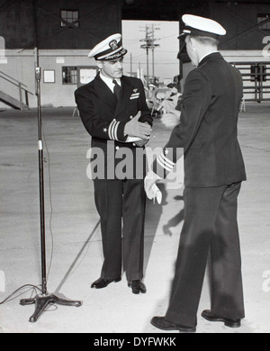 This image captures the formal change of command ceremony on the USS ...