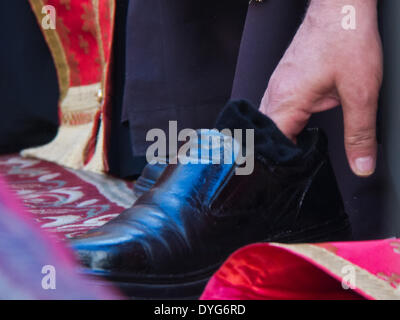 Barefooted priests await their turn in the traditional Washing of the ...