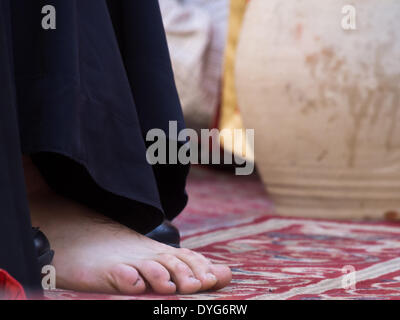 Barefooted priests await their turn in the traditional Washing of the ...