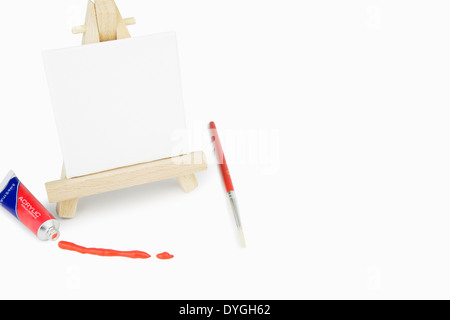 Mini easel with white blank canvas, paintbrushes. Art banner, creative ...