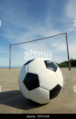 Soccer ball sitting on simple Brazilian beach football pitch with ...