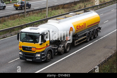 Shell lorry delivering fuel to petrol station in Ulverston, South ...
