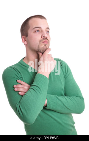 Young man thinking, hand on chin Stock Photo - Alamy