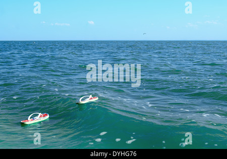 Flip-flops floating in the ocean Stock Photo - Alamy