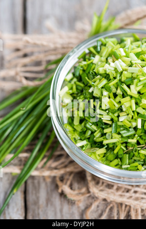 Small portion of fresh cutted Chive on vintage background Stock Photo ...