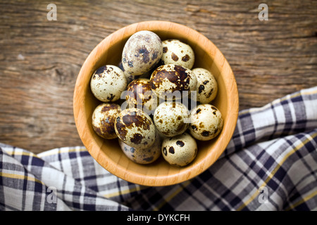 Top view of quail eggs in wooden plate on table Stock Photo - Alamy
