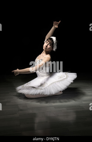 Ballerina dancing in the dark studio Stock Photo - Alamy