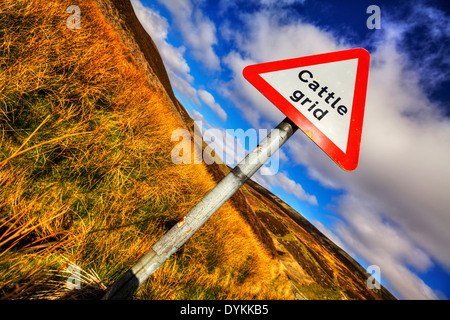 Road sign warning of Cattle grid, Horse drawn vehicles and animals ...