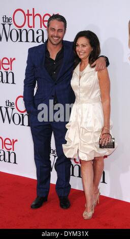 Taylor Kinney with his mother at the Los Angeles premiere of "The Other ...