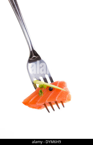 Vibrant raw salmon fillet on rustic wooden board, surrounded by fresh ...