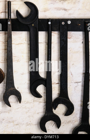 Spanners hanging on wall Stock Photo - Alamy