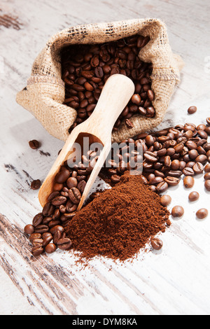 coffee beans in antique spoon on wooden board Stock Photo - Alamy