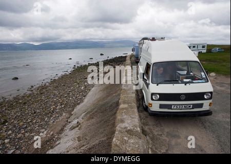Camper vans pulled up in coastal layby at Penmon on Anglesey North ...