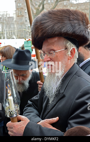 A hasidic Jewish man wearing a shtreimel fur hat out with his family ...