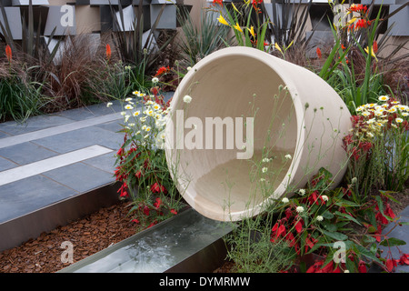 a garden with garden rill water feature made from stone water marginal ...