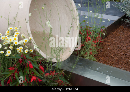 a garden with garden rill water feature made from stone water marginal ...