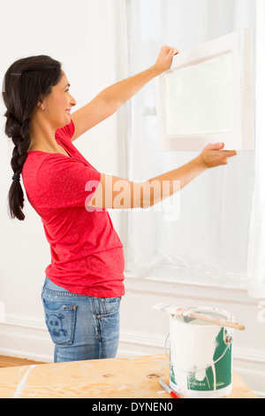 woman installing window in new house Stock Photo - Alamy