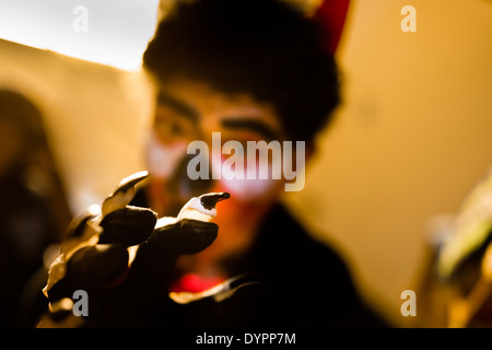 A Peruvian actor performs as Devil in the Good Friday procession during ...