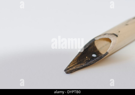 Reed pen (calamus, qalam) tip writing capital letter A in blackletter ...