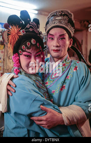 Chinese traditional opera artists pose for a picture before their daily ...