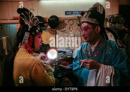 Chinese traditional opera artists pose for a picture before their daily ...