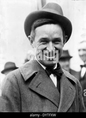 Will Rogers (1879-1935), American cowboy humorist, film star, entertainer, and writer, holding ...