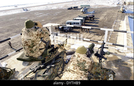 Soldier of ISAF German Armed Forces securing the entrance to the Camp ...